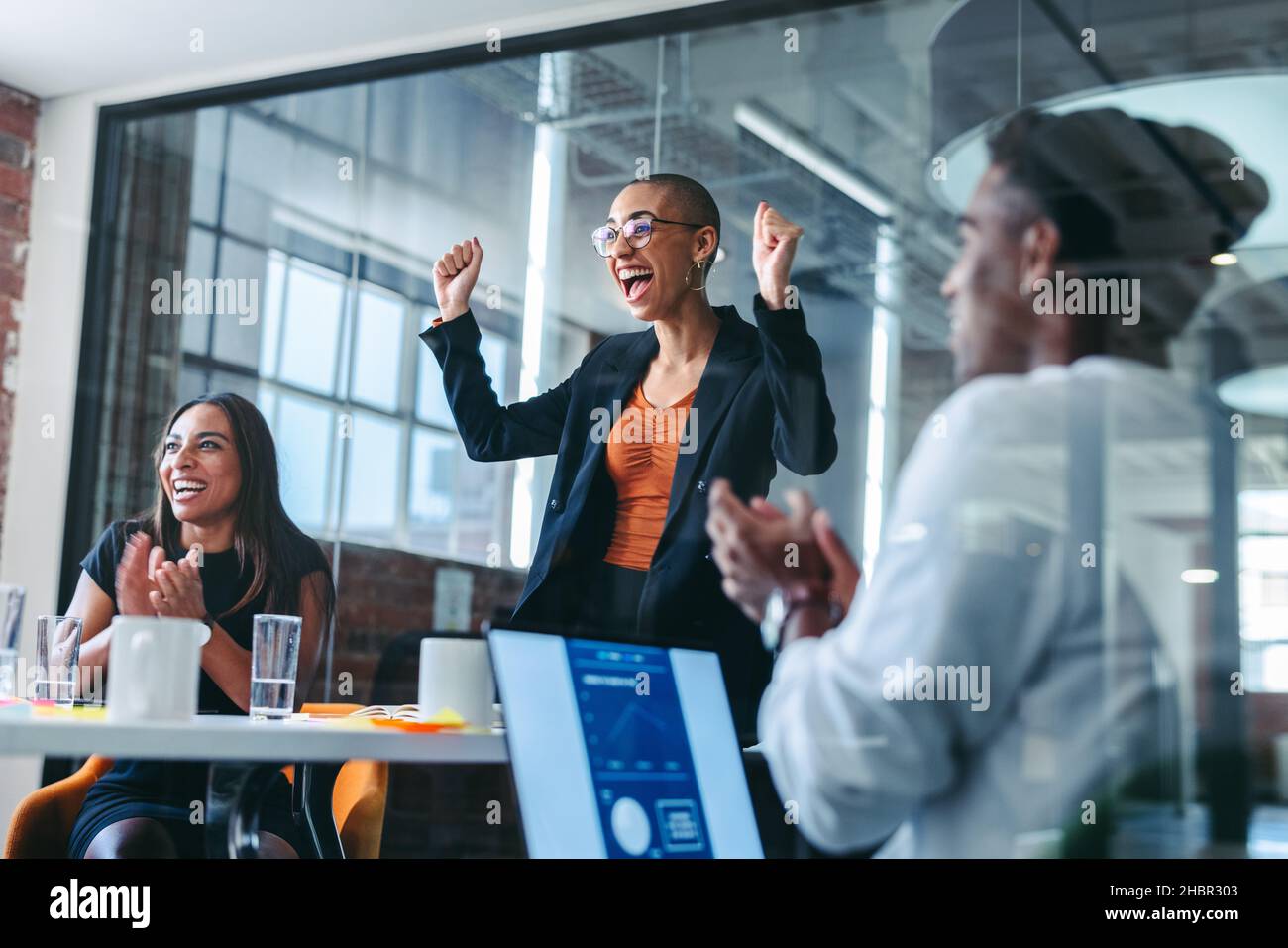Employee of the month. Cheerful young businesswoman smiling while being ...