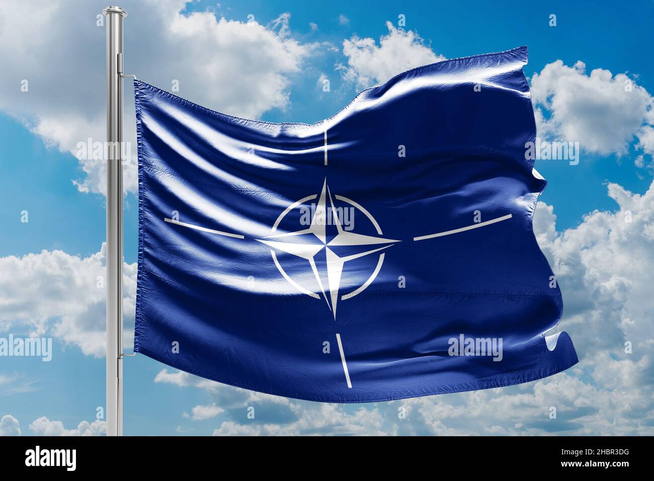 NATO flag waving by the wind Stock Photo - Alamy
