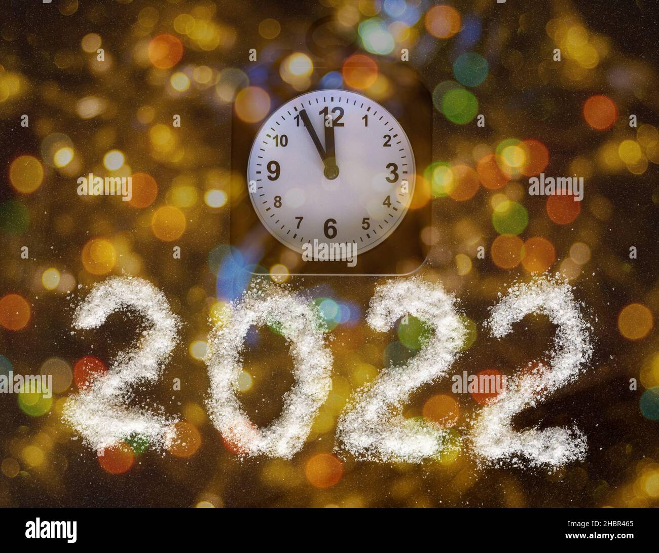 Classic alarm clock showing the time 23:55 and the year 2022 written ...