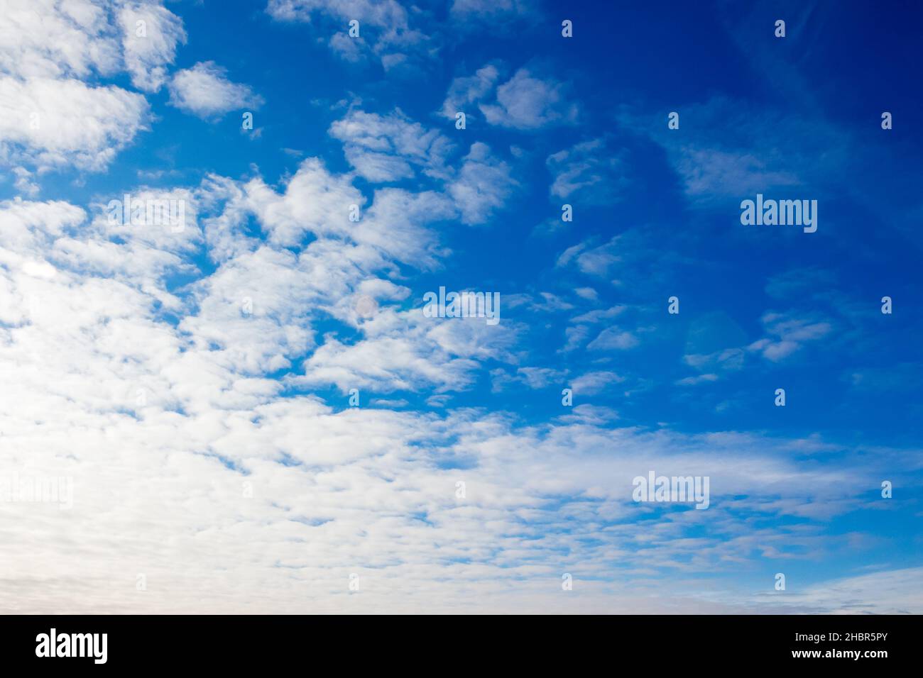 white fluffy clouds on a deep blue sky. sunny weather conditions Stock ...