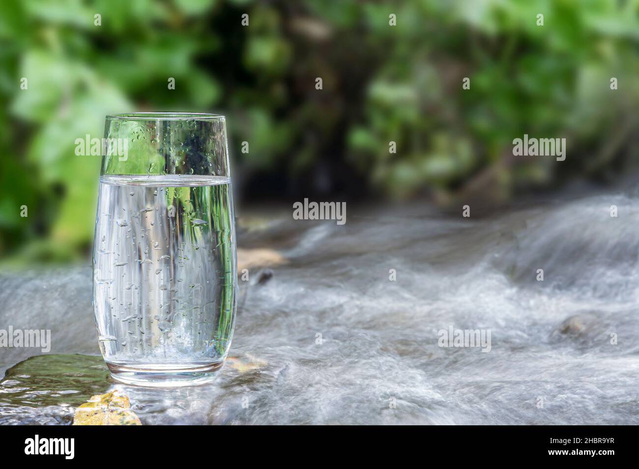 a glass of clean transparent drinking water in a transparent glass on a ...
