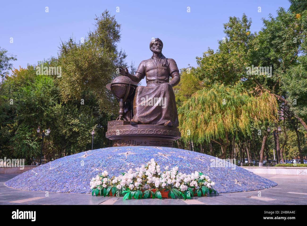 A bronze statue of the famous astronomer Mirzo Ulugbek with a globe. In ...