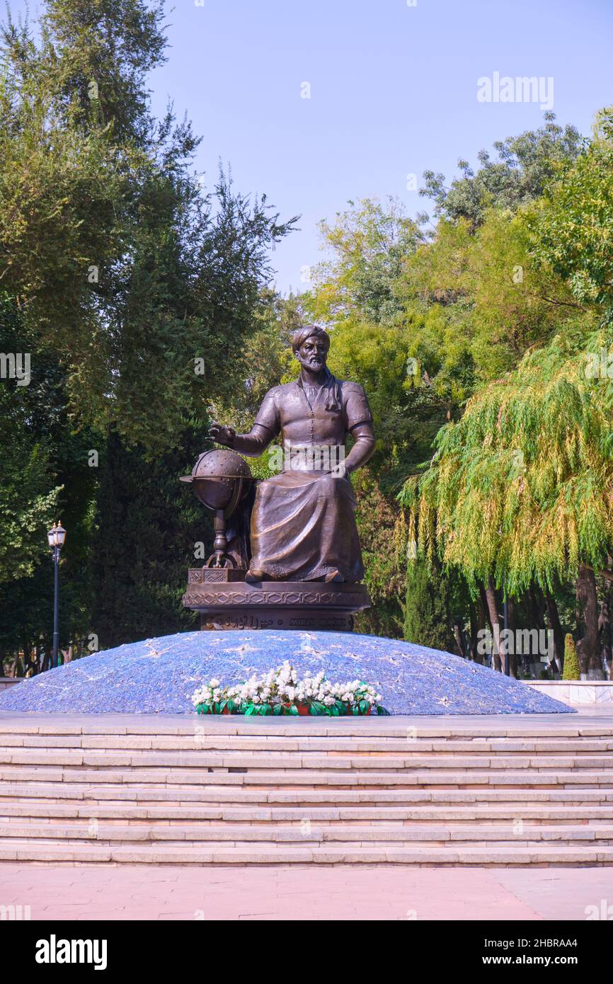 A bronze statue of the famous astronomer Mirzo Ulugbek with a globe. In ...