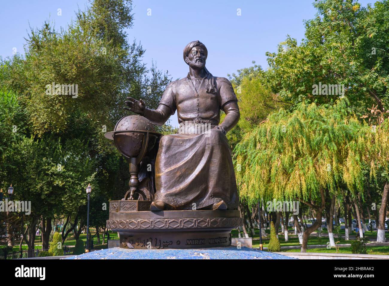 A bronze statue of the famous astronomer Mirzo Ulugbek with a globe. In ...