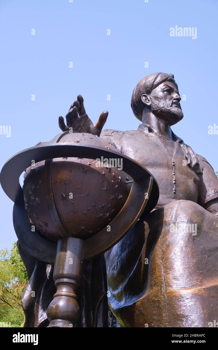 A bronze statue of the famous astronomer Mirzo Ulugbek with a globe. In ...