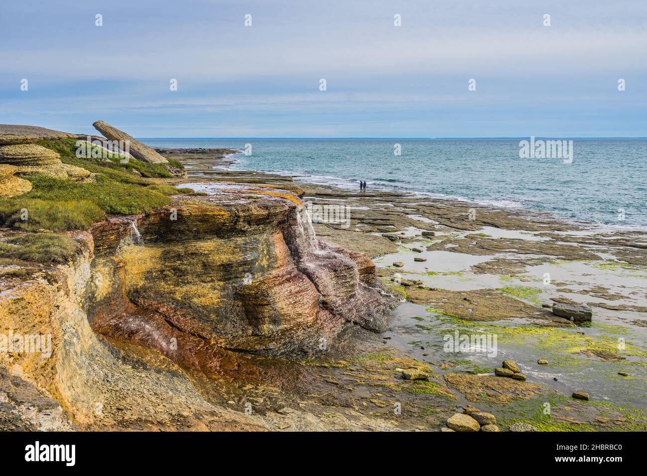 View on the Cap Ferre waterfall, a small waterfall rich in iron (thus ...
