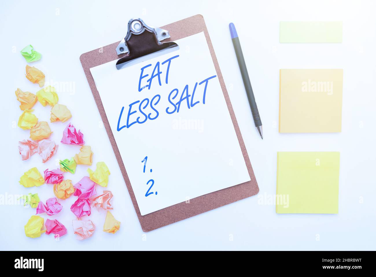 Hand writing sign Eat Less Salt. Conceptual photo reducing the sodium ...