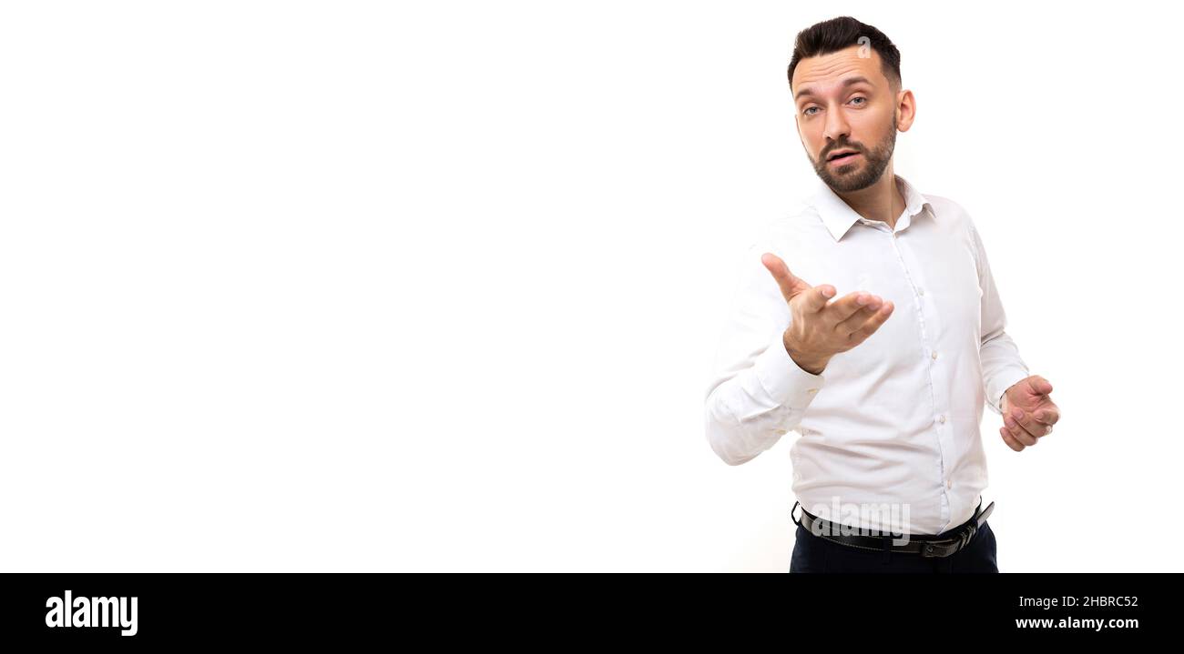 a man inquiring stretches his hand forward in surprise raised his ...