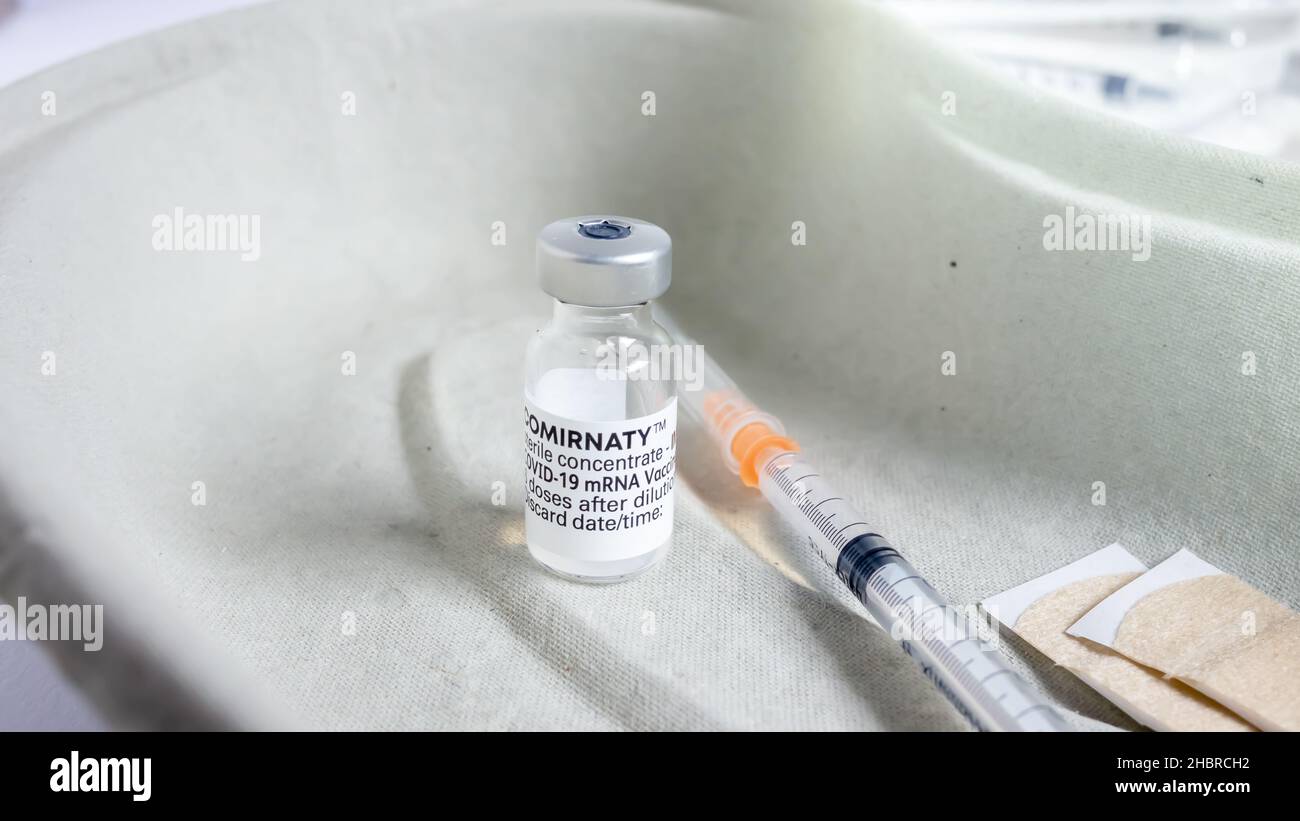 A vial with Pfizer Biontech COVID-19 mRNA vaccine, Comirnaty, booster ...