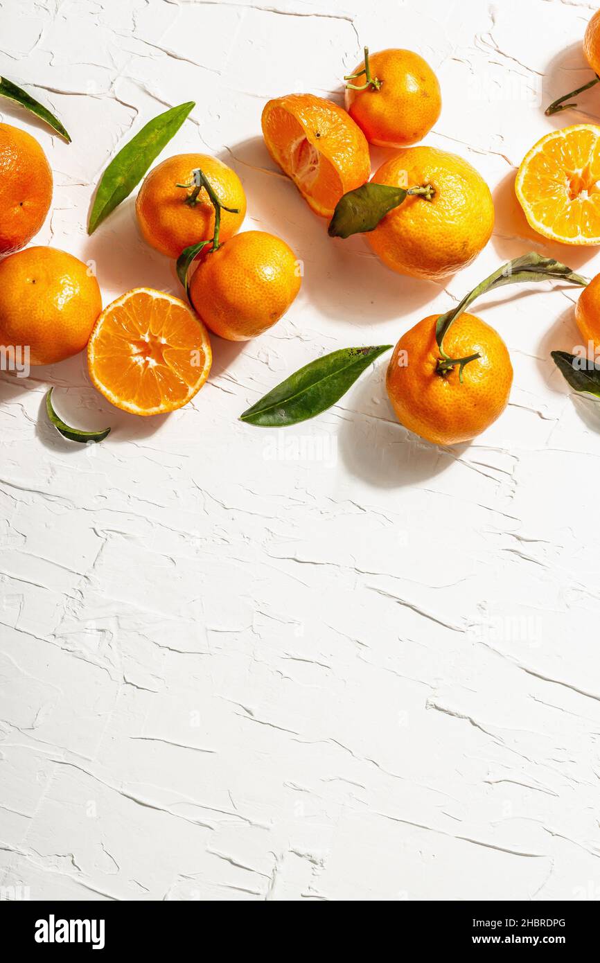 Tangerines (oranges, mandarins, clementines, citrus fruits) with green ...