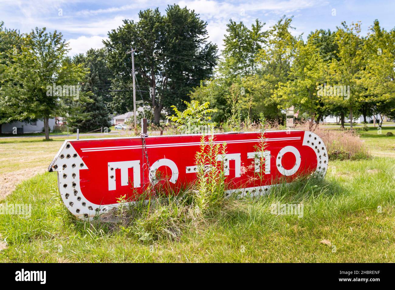 old office sign with arrow laid on grass at Henrys Rabbit Ranch ...