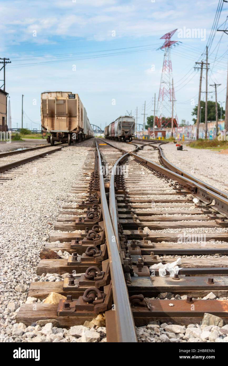 low perspective view along train tracks and rusty goods wagons Stock ...