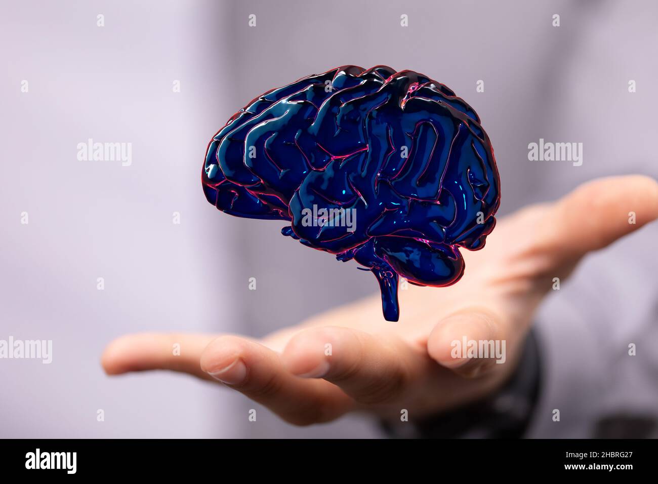 A male hand with a 3D rendered human brain over it - innovation ...