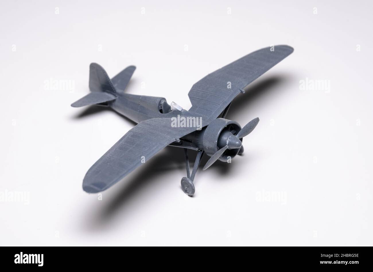 Plastic model of a high-wing aircraft with propeller on white ...