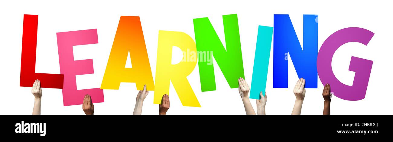 Learning - human hands holding colorful letters Stock Photo - Alamy