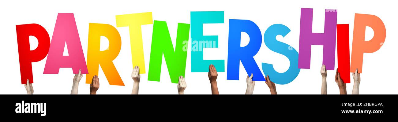 Partnership - human hands holding colorful letters Stock Photo - Alamy