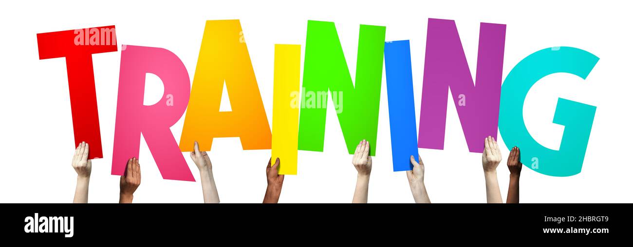 Training - human hands holding colorful letters Stock Photo - Alamy