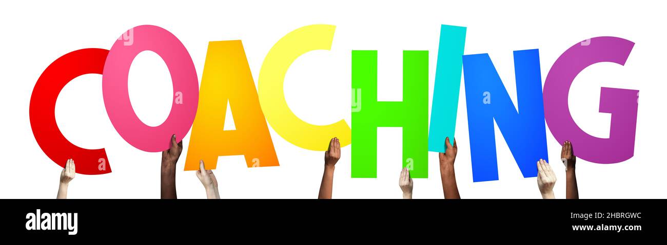 Coaching - human hands holding colorful letters Stock Photo - Alamy