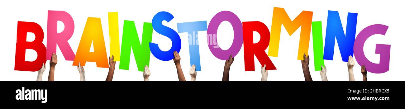 Brainstorming - human hands holding colorful letters Stock Photo - Alamy