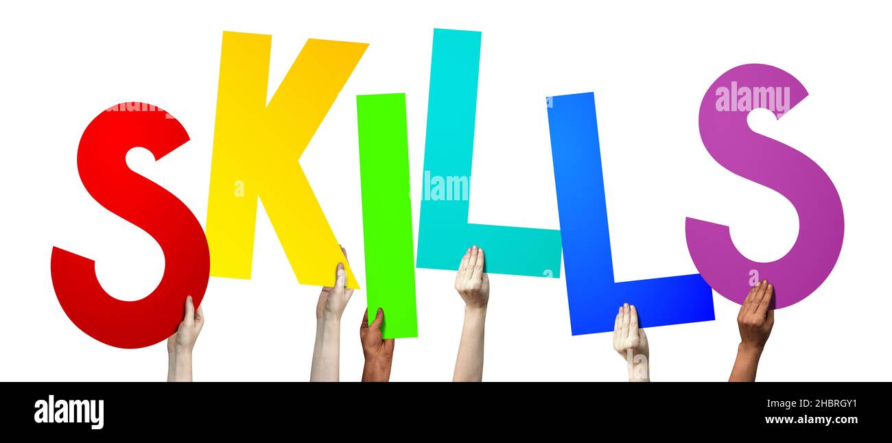 Skills - human hands holding colorful letters Stock Photo - Alamy