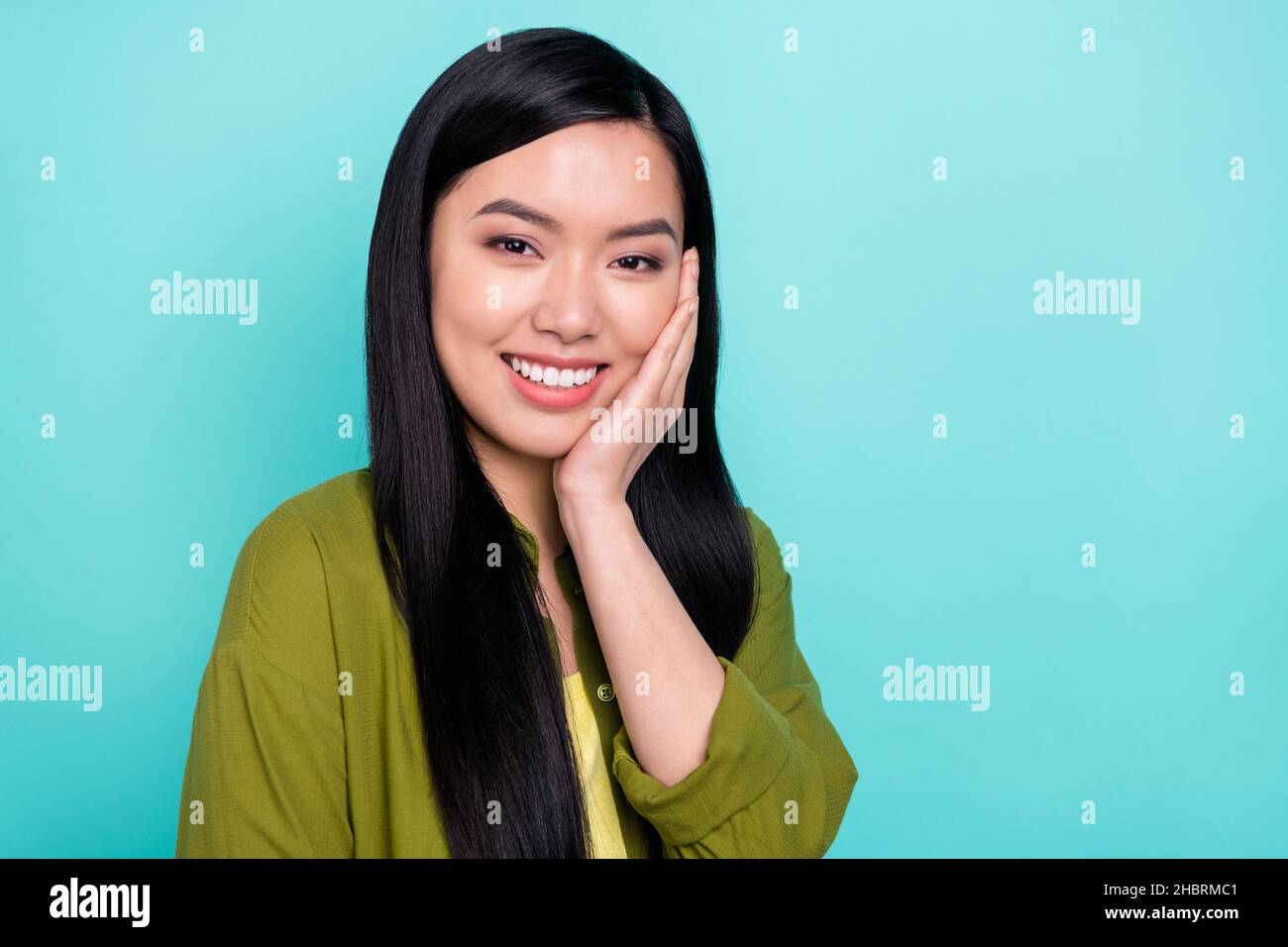 Photo of young attractive asian girl happy positive smile hand touch ...