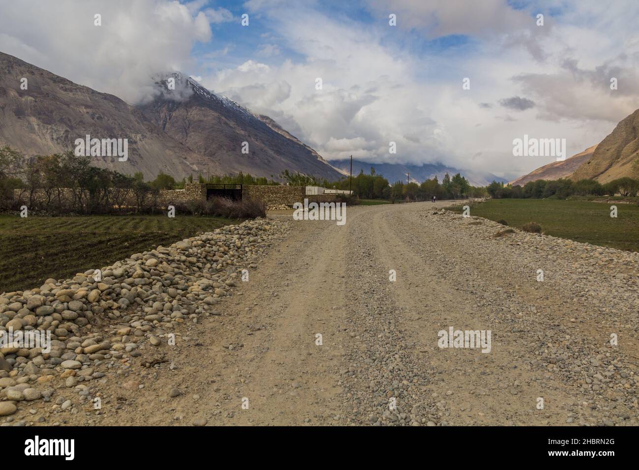 Road in Langar village in Wakhan valley between Tajikistan and ...