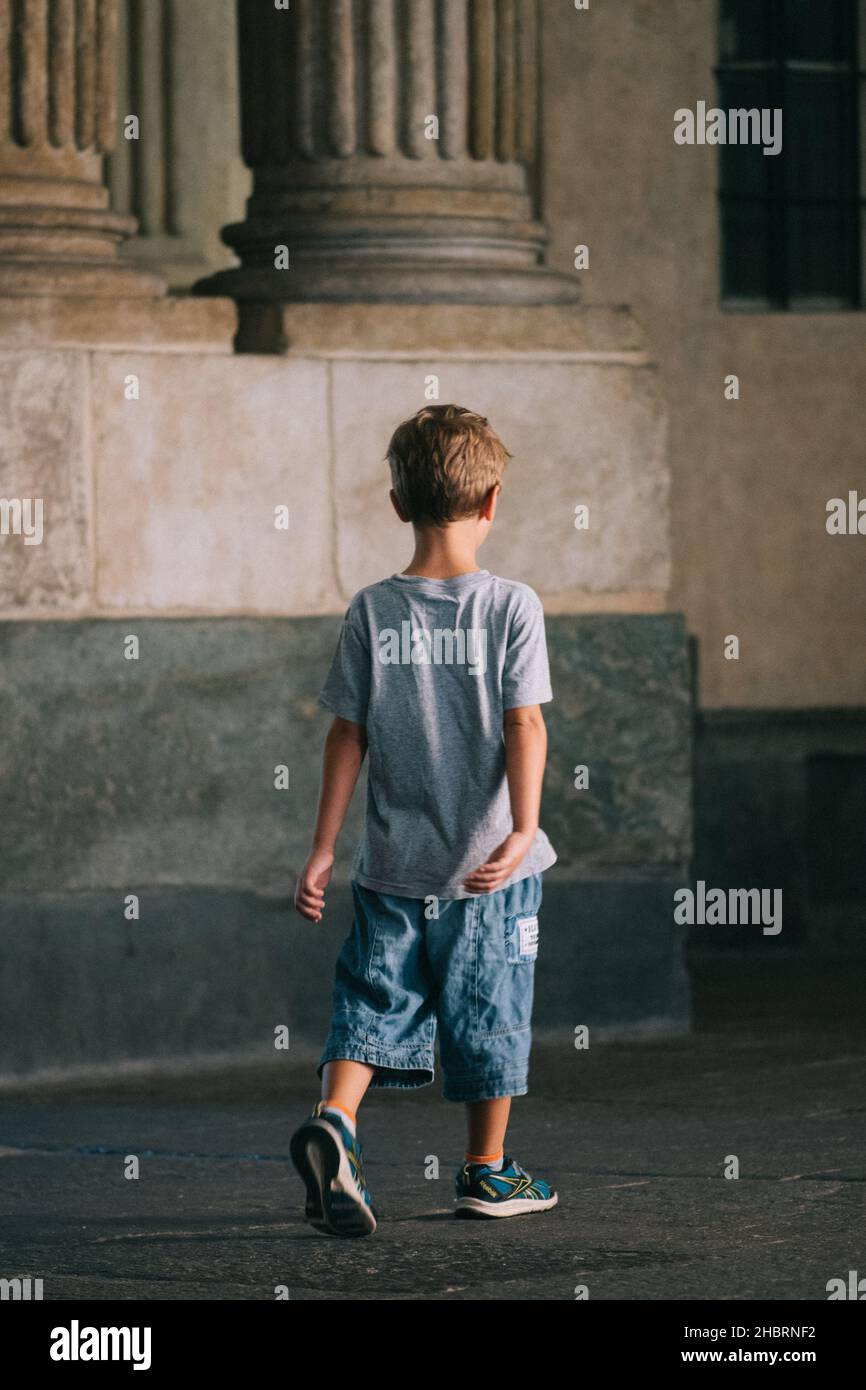 Kid or child walking alone in the city Stock Photo - Alamy