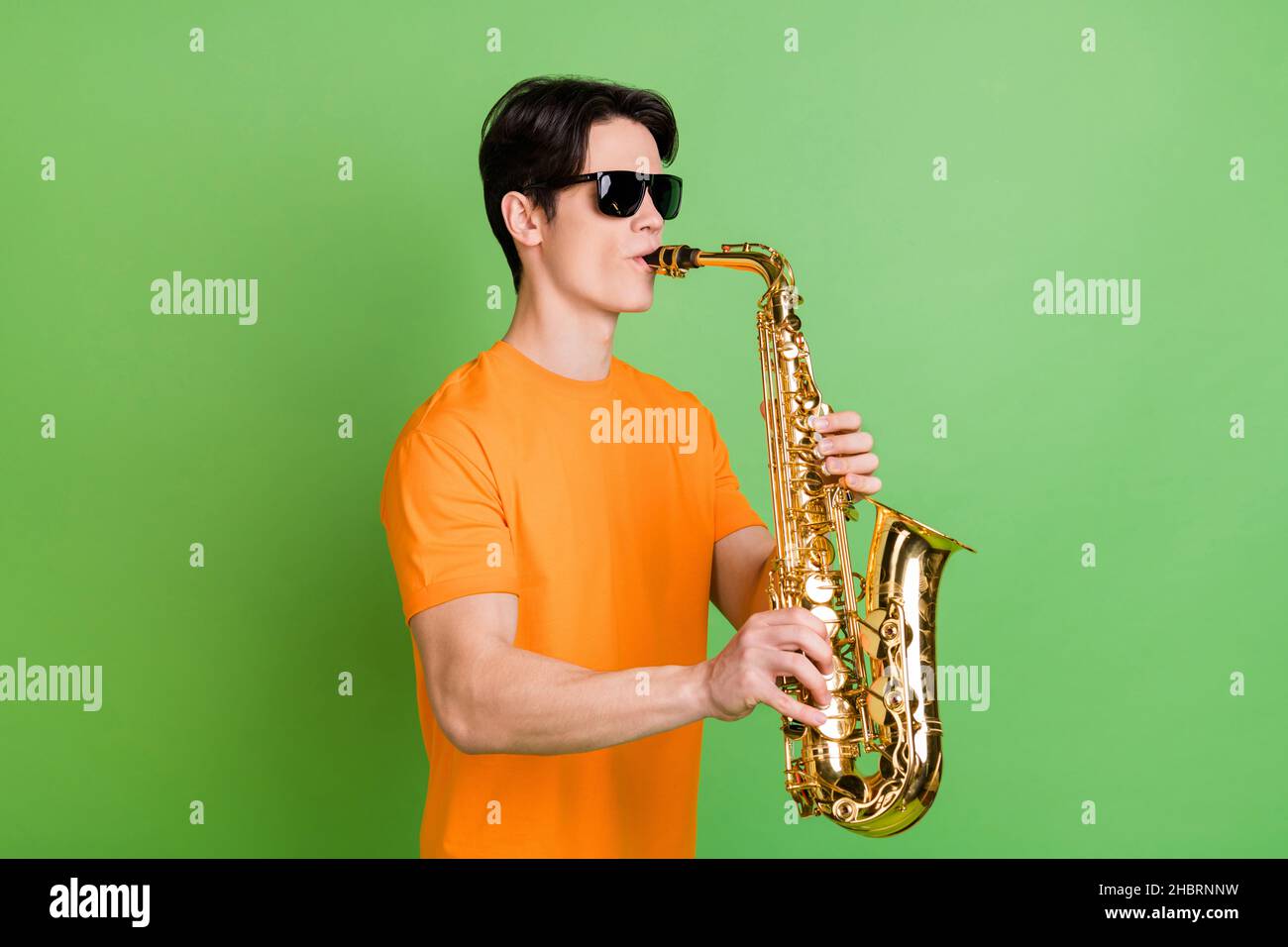 Attractive young male saxophone player hi-res stock photography and ...