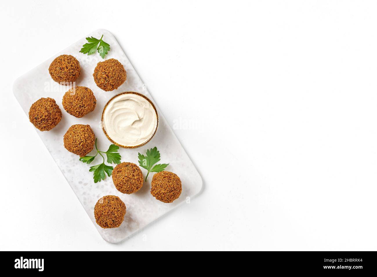 Chickpeas falafel with tahini sauce. Top view, copy space Stock Photo ...