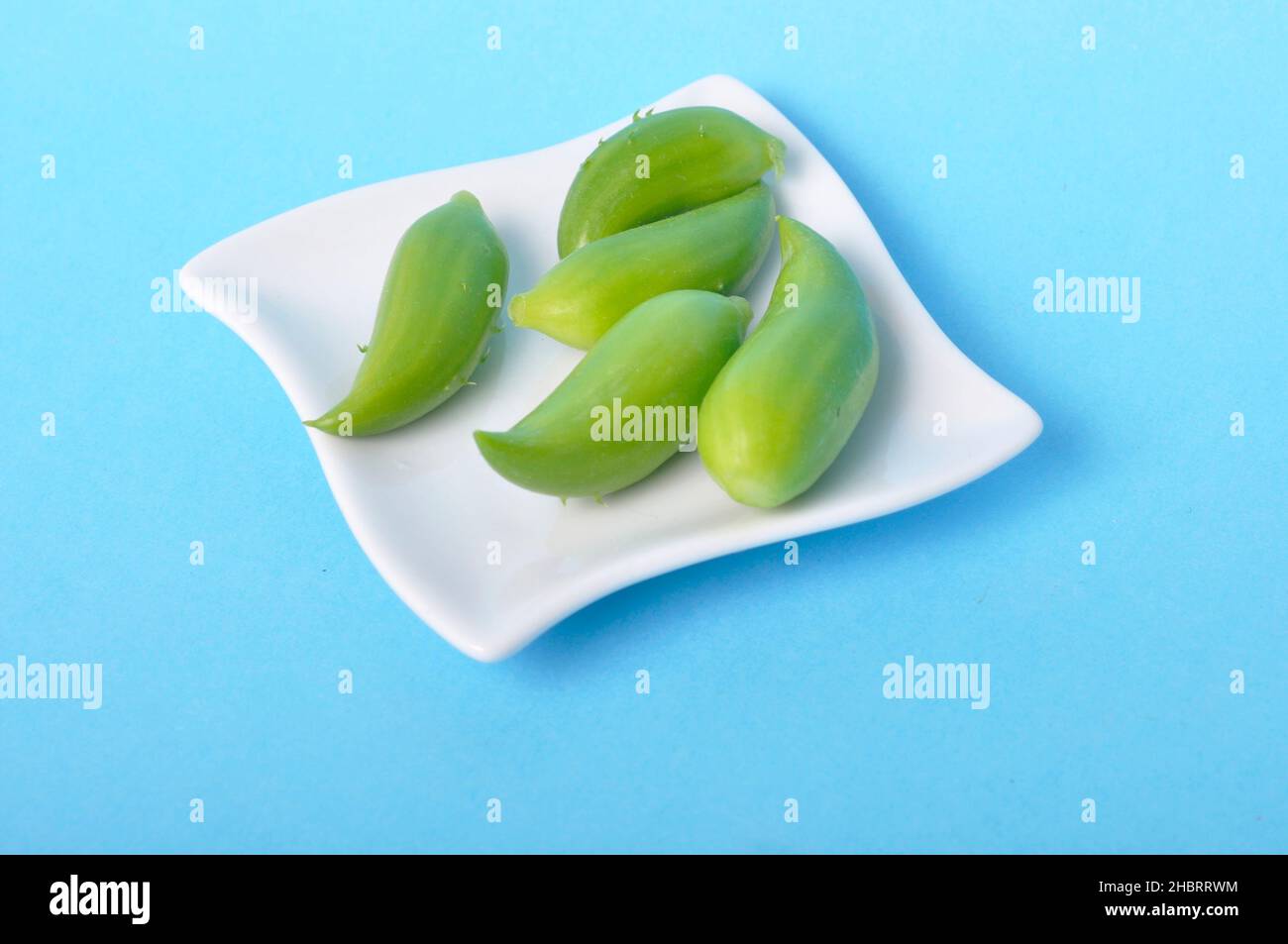 Achocha in a saucer on a blue background Stock Photo - Alamy