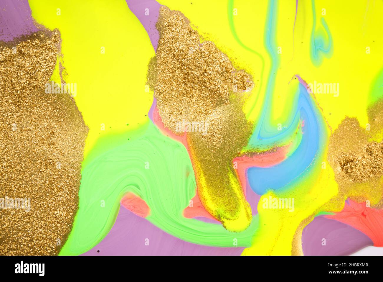 Mix of acrylic vivid colorful inks with gold dust Stock Photo - Alamy