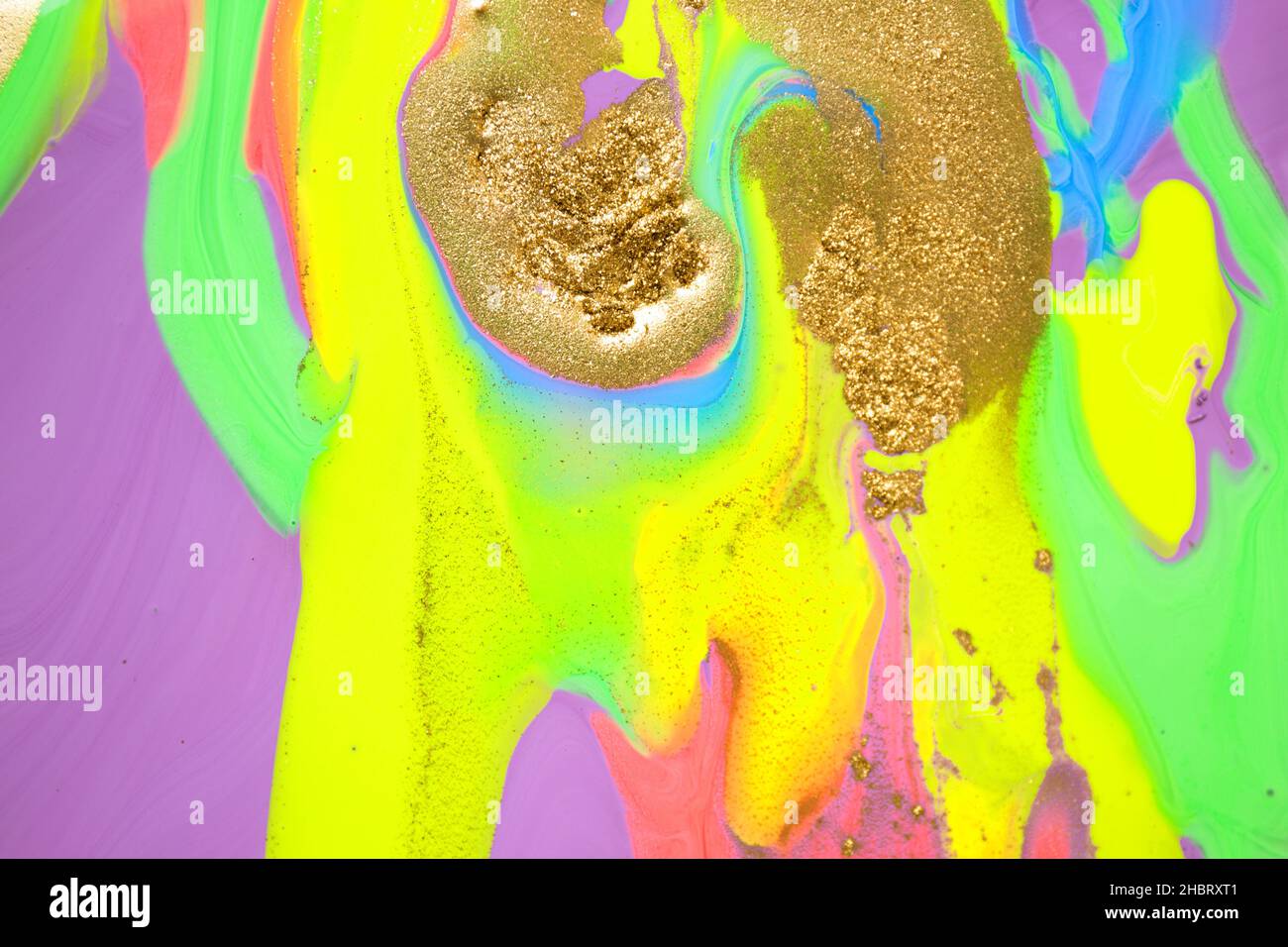 Mix of acrylic vivid colorful inks with gold dust Stock Photo - Alamy