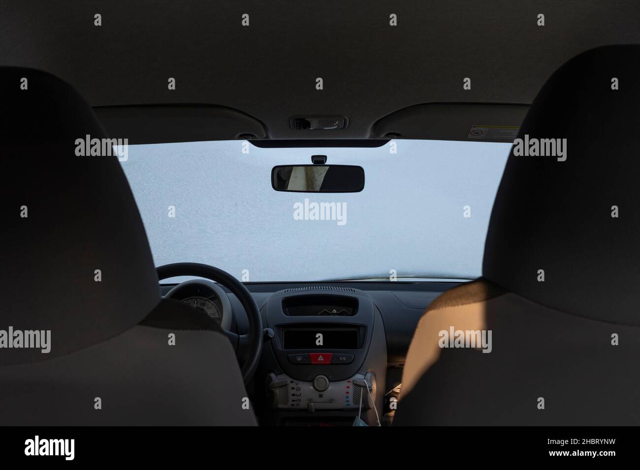 Interior of a car dashboard with ice on the front glass Stock Photo - Alamy