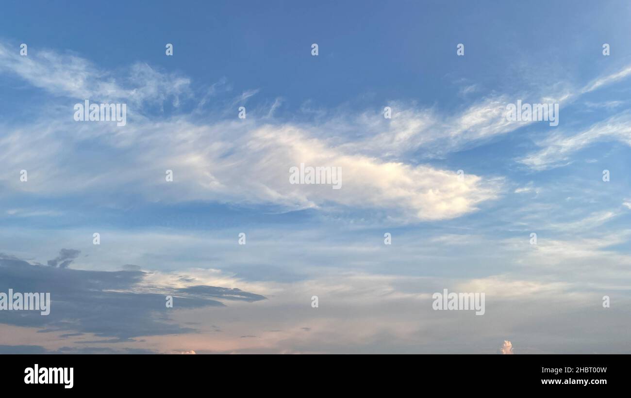 Pattern of clouds forming in blue sky creating an abstract background ...
