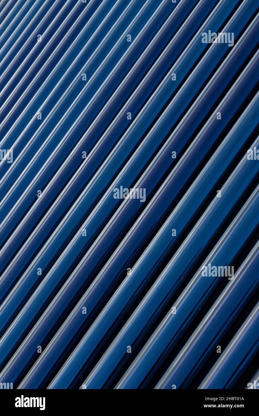 View of Solar panel tubes in a line as abstract patterns and background ...