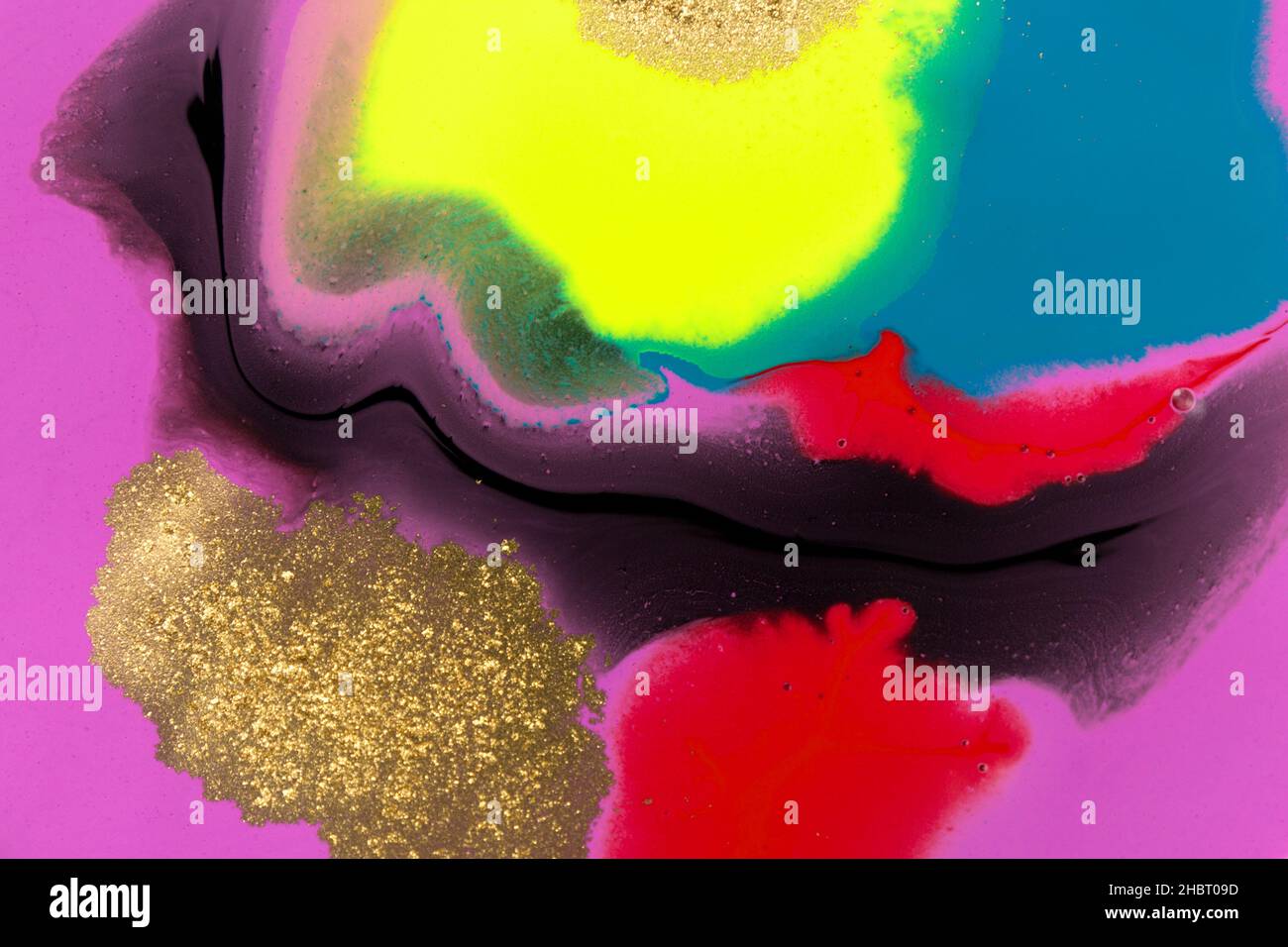 Abstract fluorescent ink liquid mix with gold dust Stock Photo - Alamy
