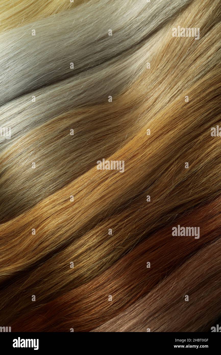 Different color female hair on whole background, close up Stock Photo ...