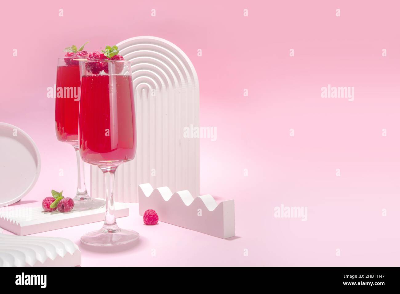 Red mimosas cocktail. Classic mimosa drink with raspberry juice ...