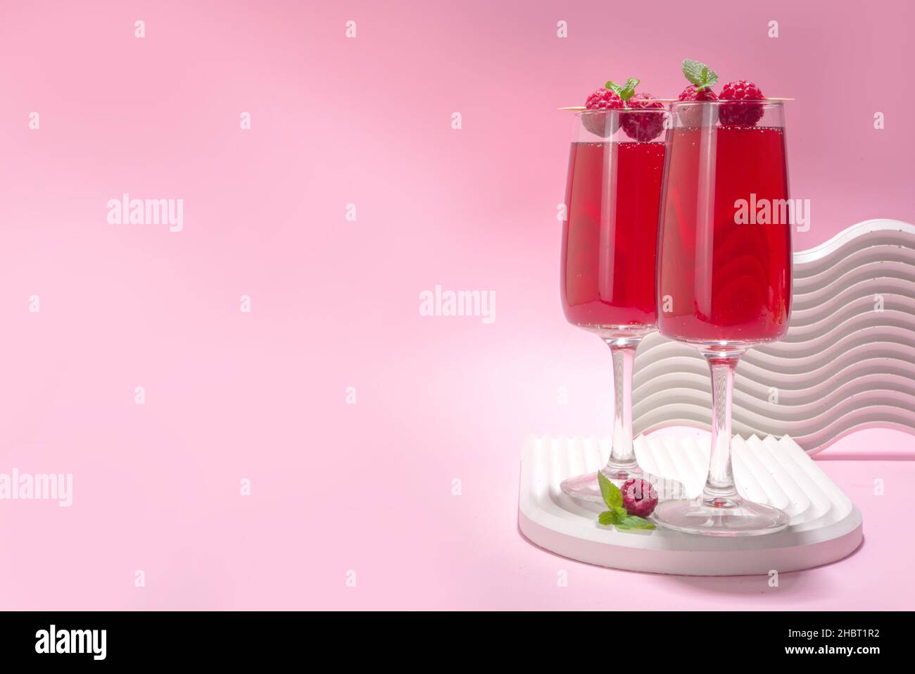 Red mimosas cocktail. Classic mimosa drink with raspberry juice ...