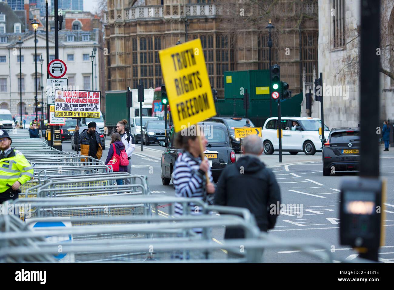 Placards are held near the Houses of Parliament in central London Stock ...