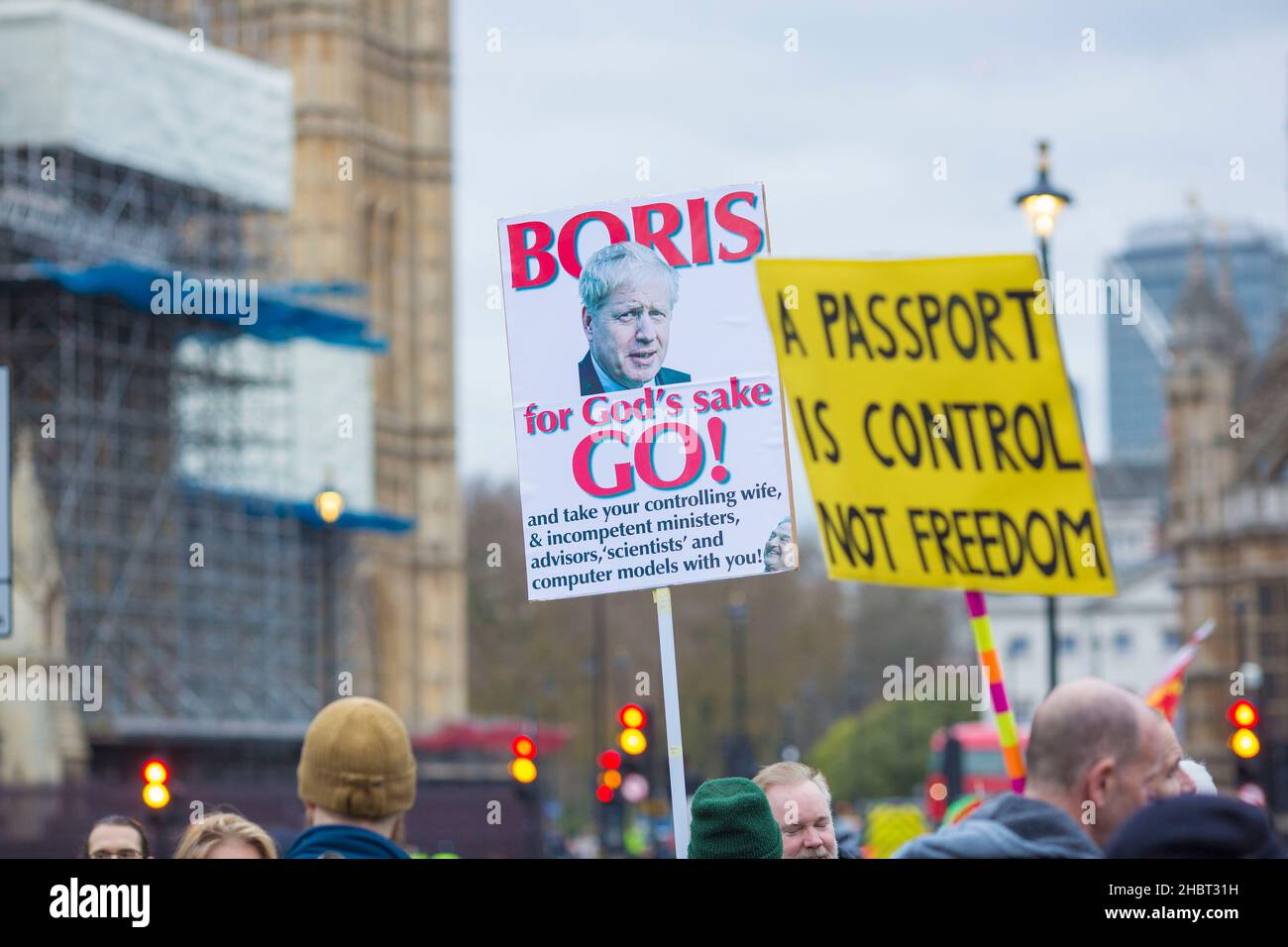 Placards are held near the Houses of Parliament in central London Stock ...