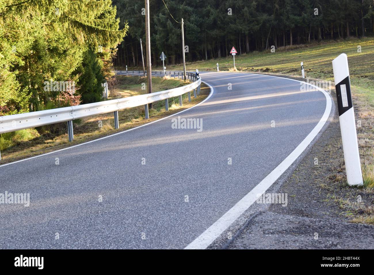 country road curve in early winter Stock Photo - Alamy