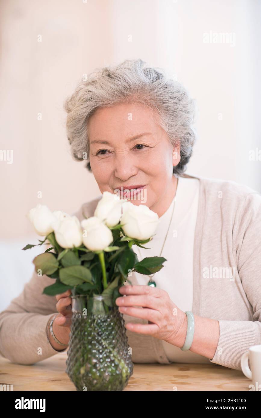 The elderly and flowers Stock Photo - Alamy