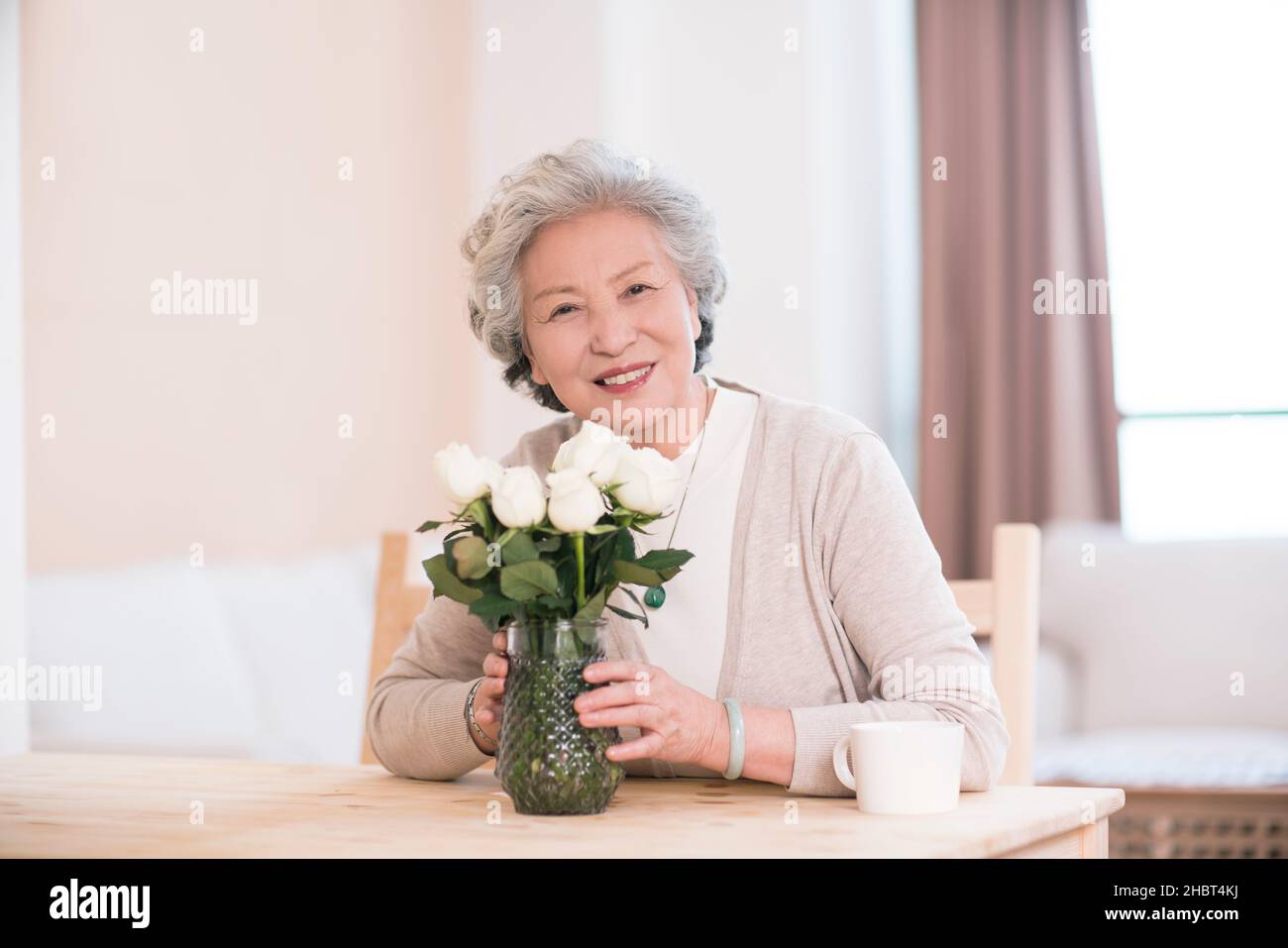 The elderly and flowers Stock Photo - Alamy