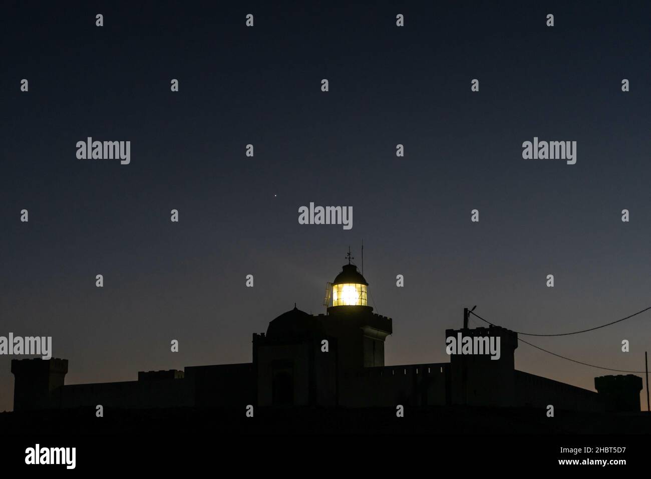 A lighthouse under the dark night sky Stock Photo - Alamy