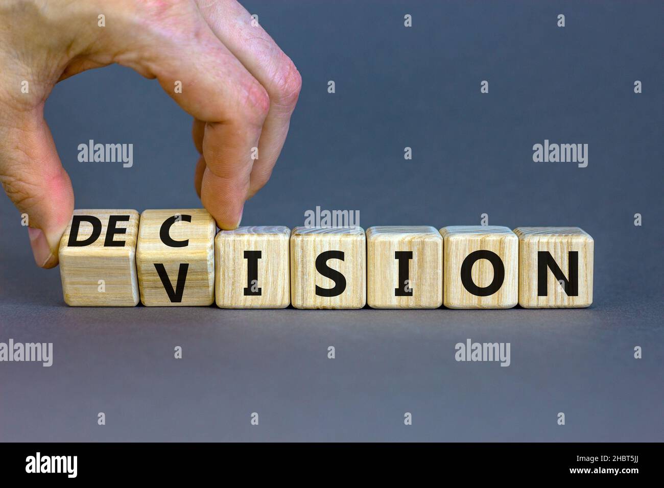 Vision and decision symbol. Businessman turns wooden cubes and changes ...