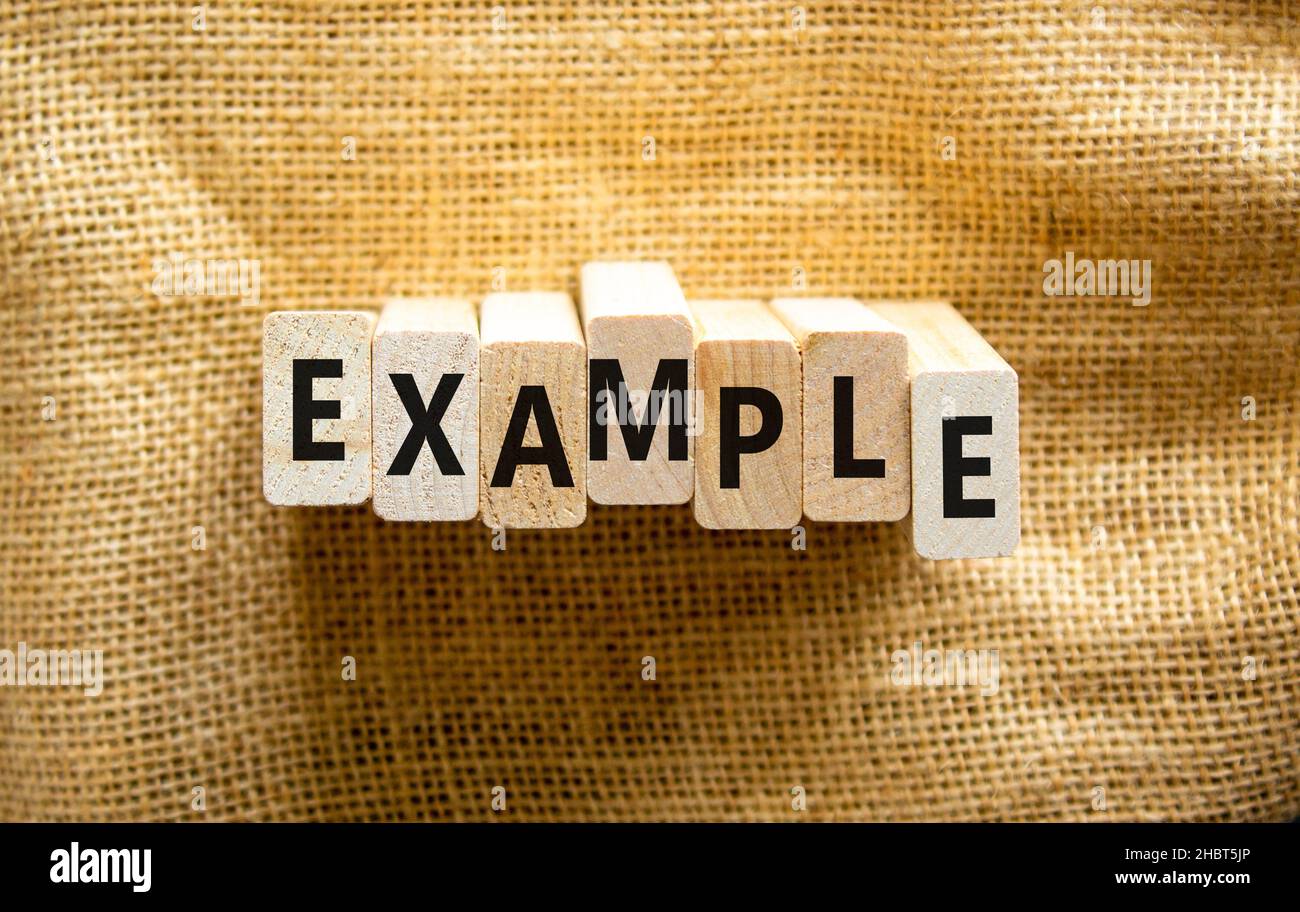 Example symbol. The concept word Example on wooden blocks. Beautiful ...