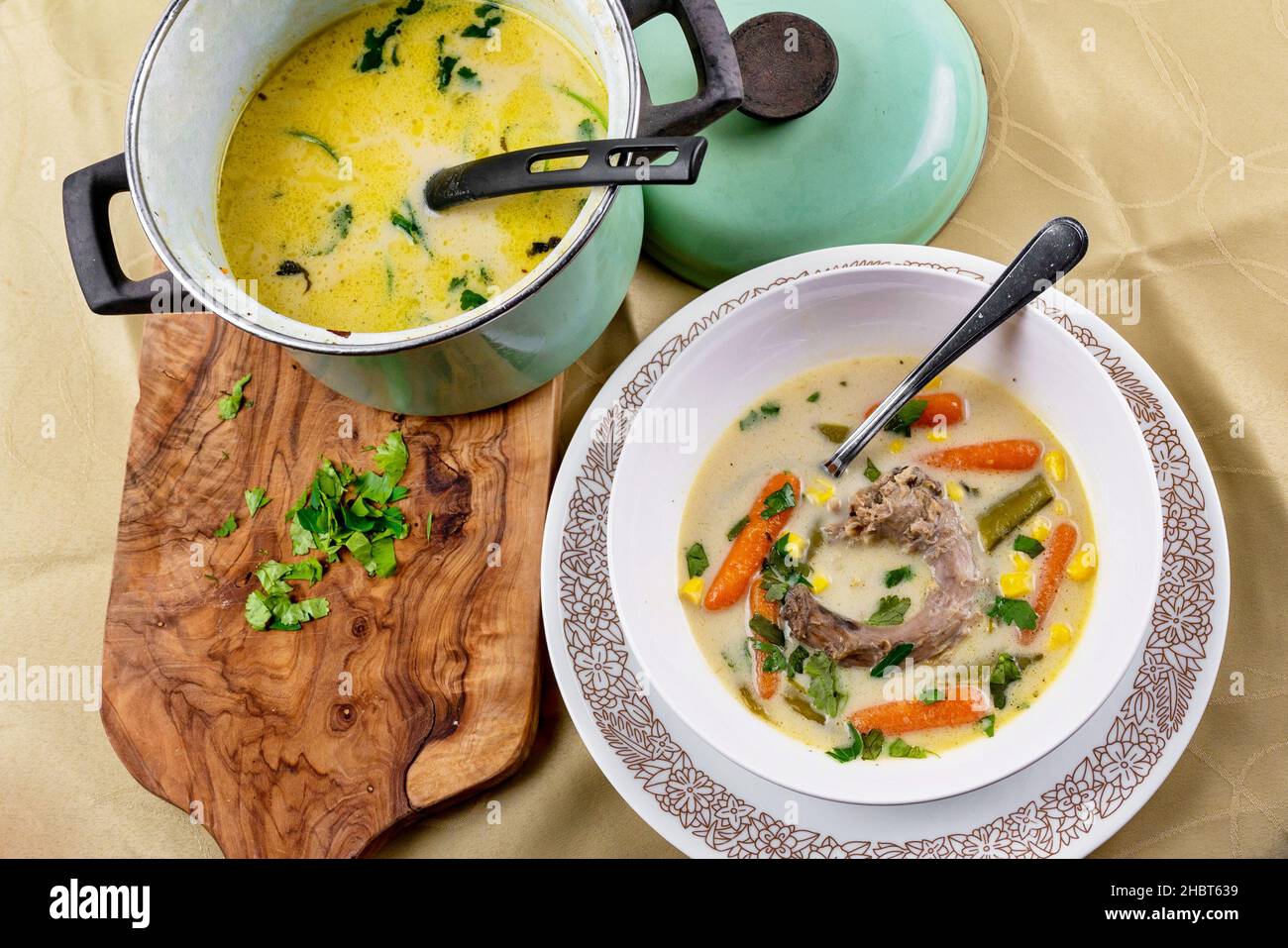 Homemade cooking and dining, hen soup with vegetable in plate and pot ...