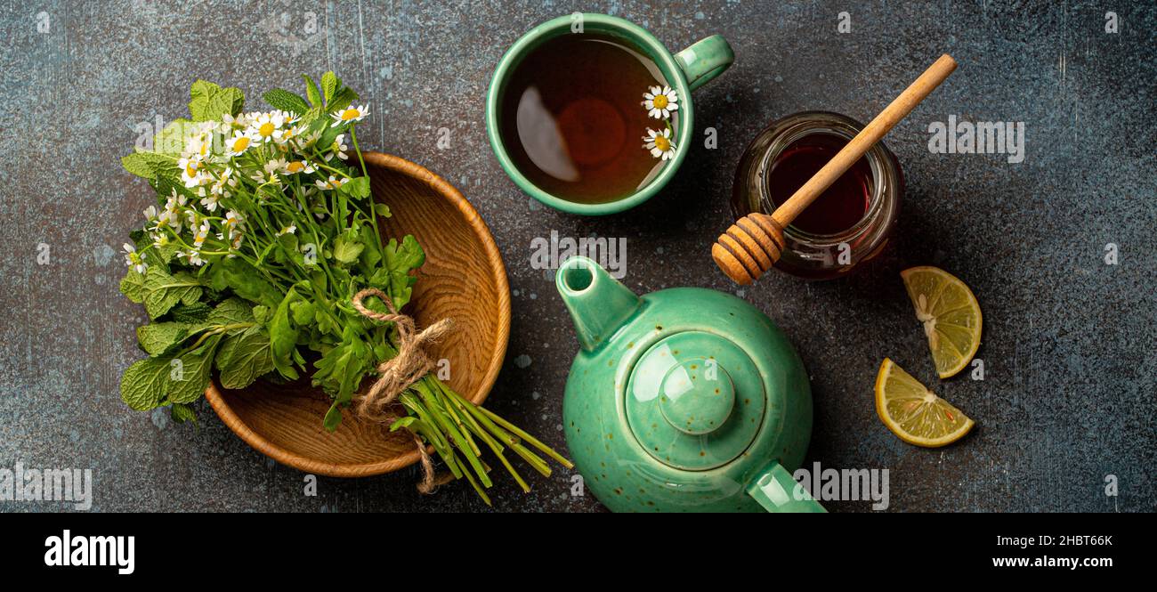 Herbal tea with natural healing medical herbs, tea cup, tea pot top ...