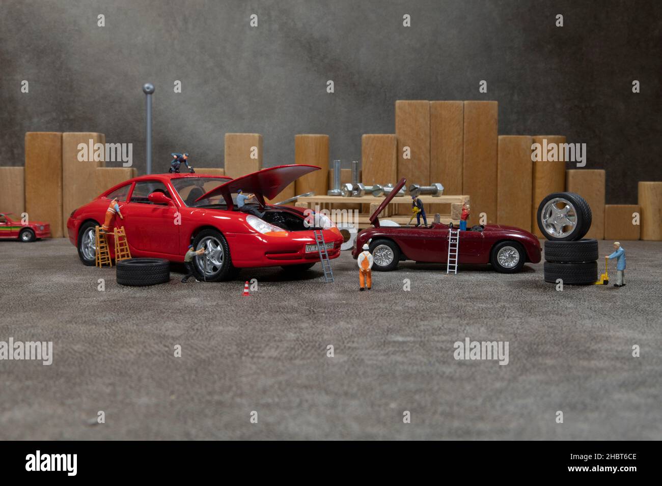little world car garage man busy with reparing cars Stock Photo - Alamy